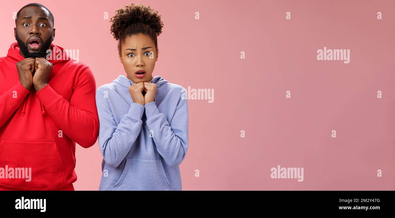 Upset worried two siblings watching together scary disturbing horror ...