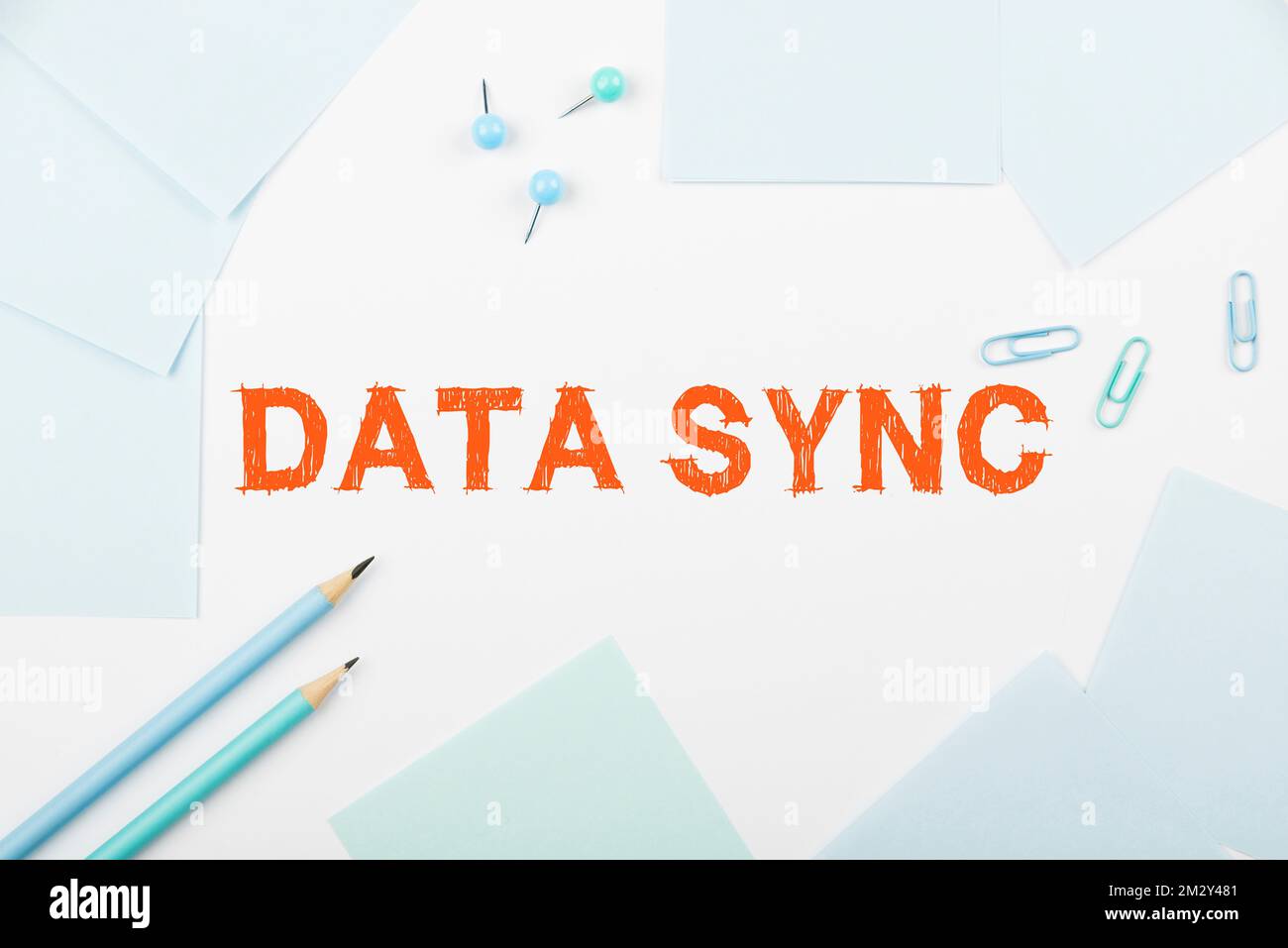 Hand writing sign Data Sync. Conceptual photo data that is continuously ...