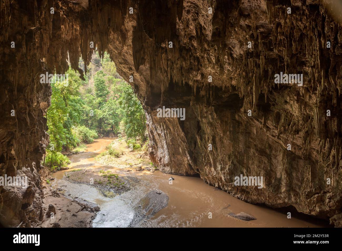 Enormous cave entrance with river flowing inside it. Tham Lot (Lod ...