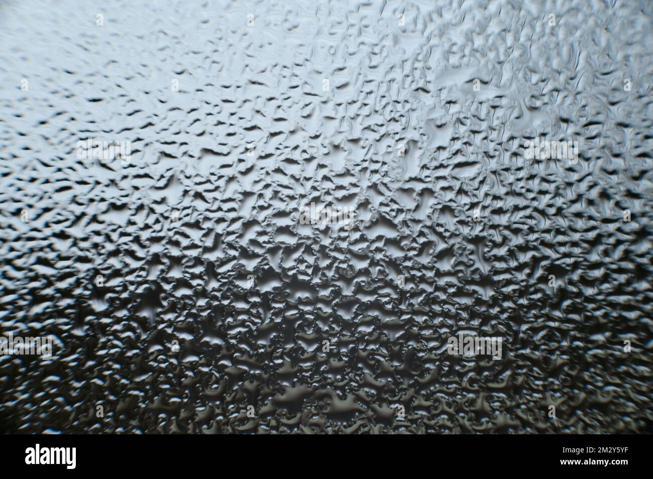 large drops of dew on the window after condensation on the window ...