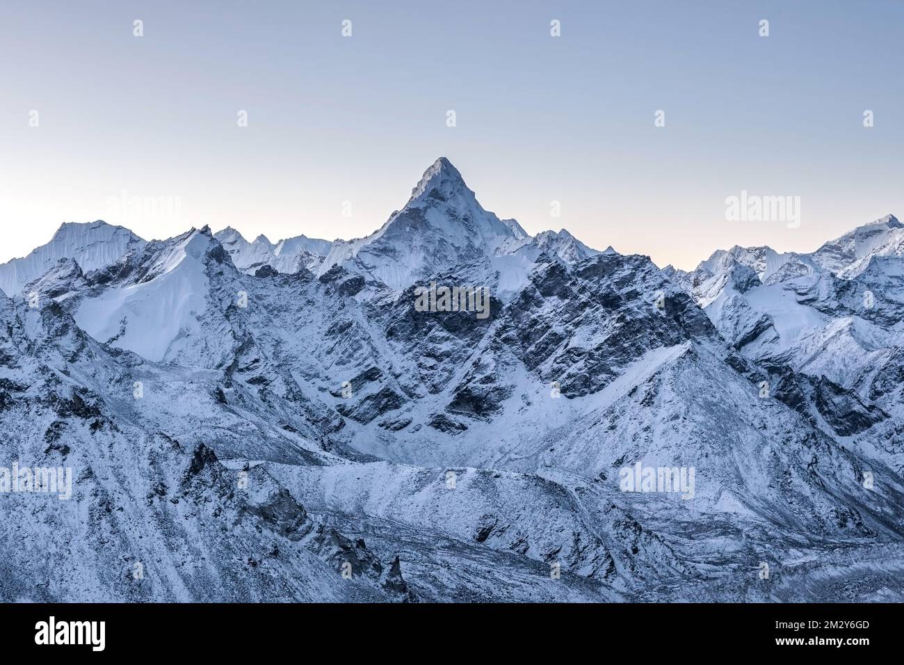 Beautiful Ama Dablam peak lit by the first rays of morning sun. Sharp ...