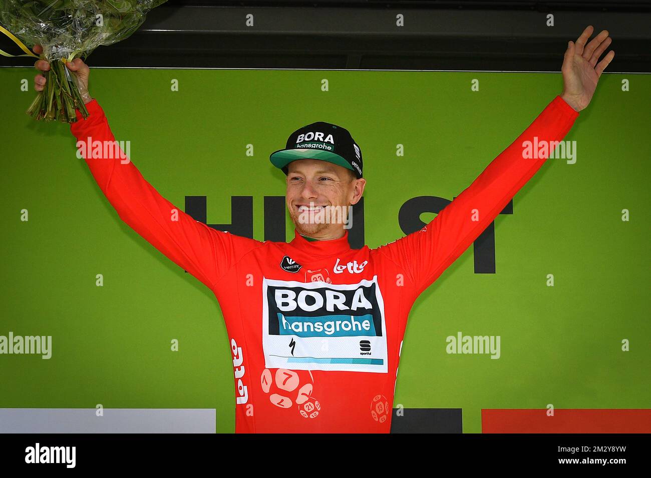 Irish Sam Bennett of Bora-Hansgrohe celebrates on the podium in the red ...
