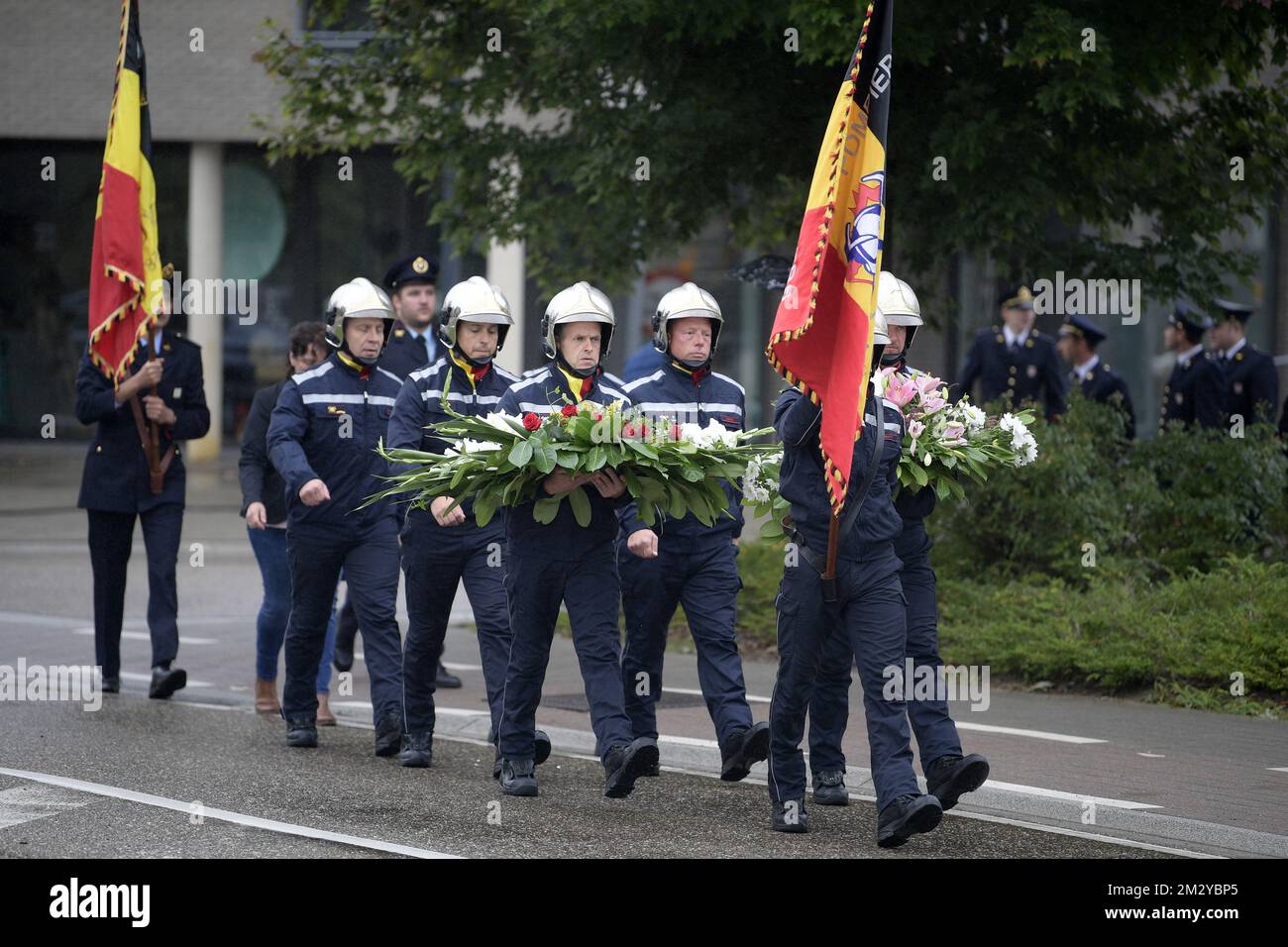 Illustration picture shows firefighters carrying flower wreaths, at a ...