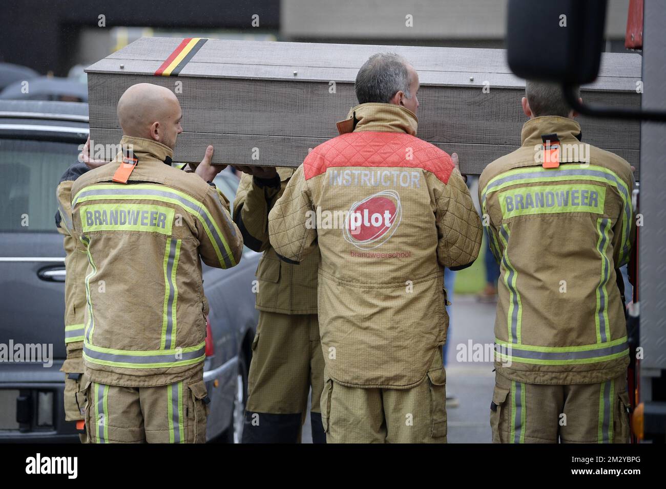 Illustration picture shows colleagues carrying the coffin of a deceased ...