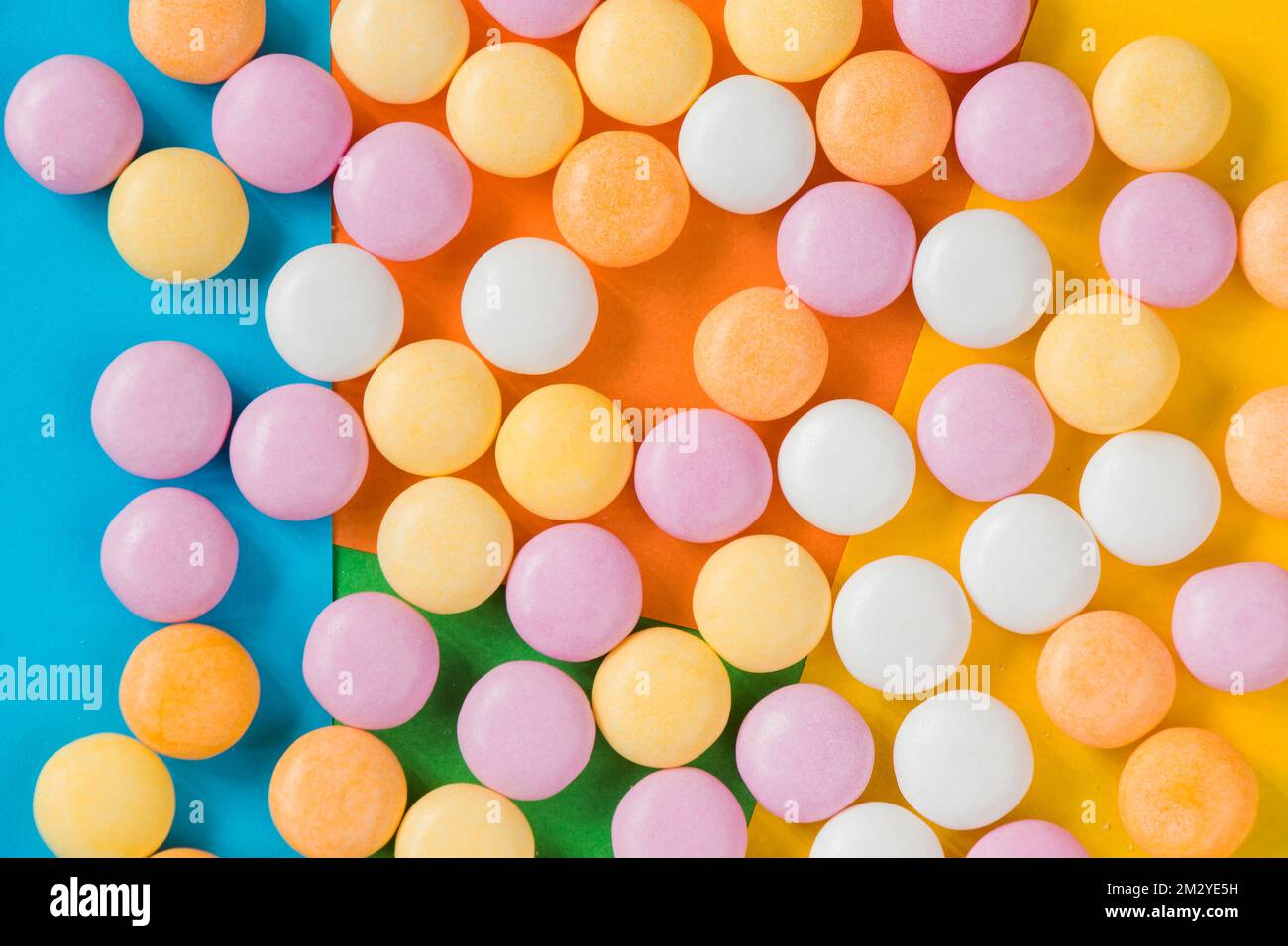 Candy on the colorful background, high angle view, circle candies Stock ...