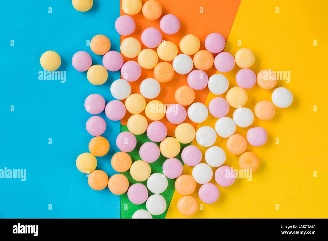 Candy on the colorful background, high angle view, circle candies Stock ...