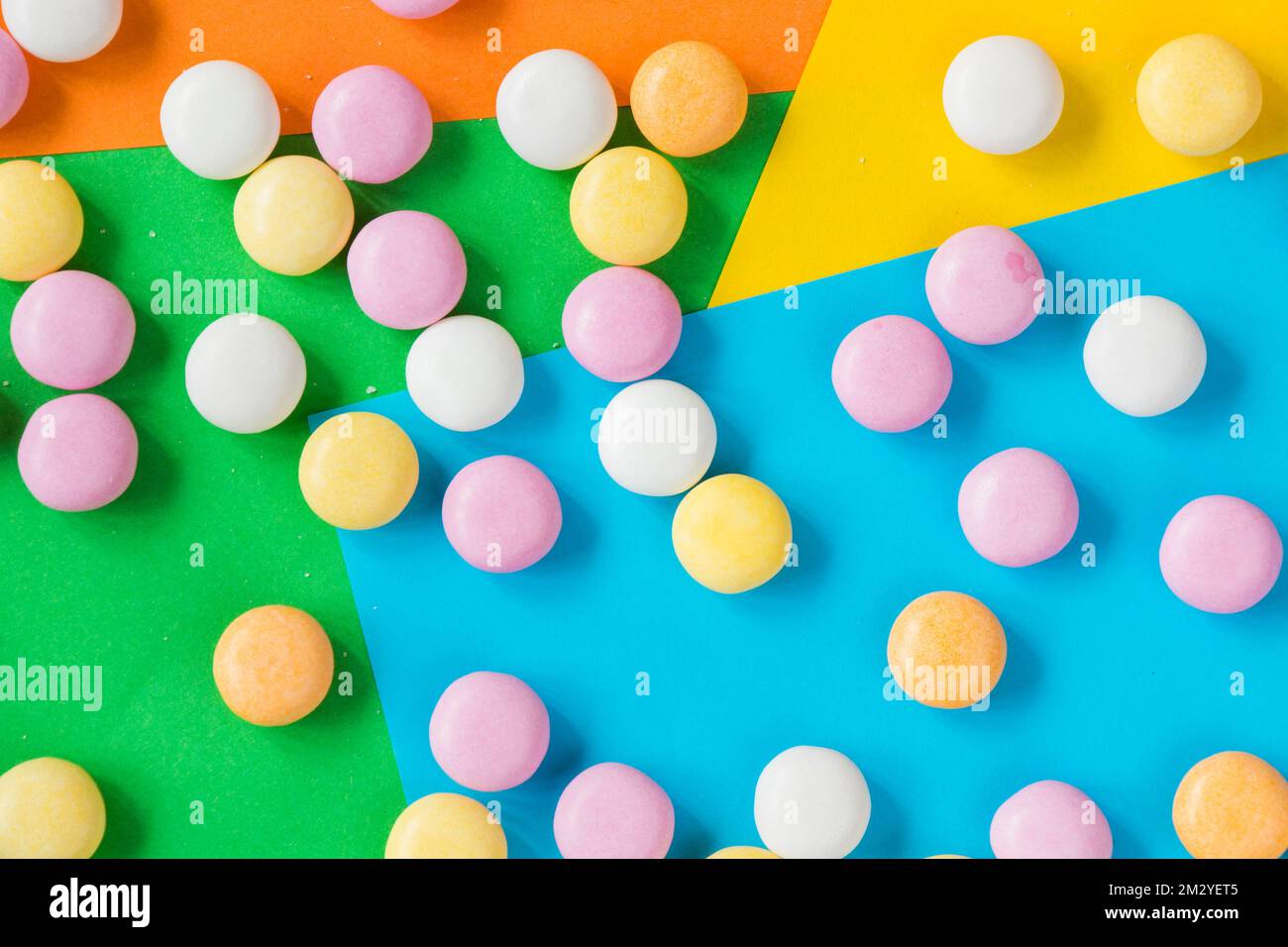 Candy on the colorful background, high angle view, circle candies Stock ...