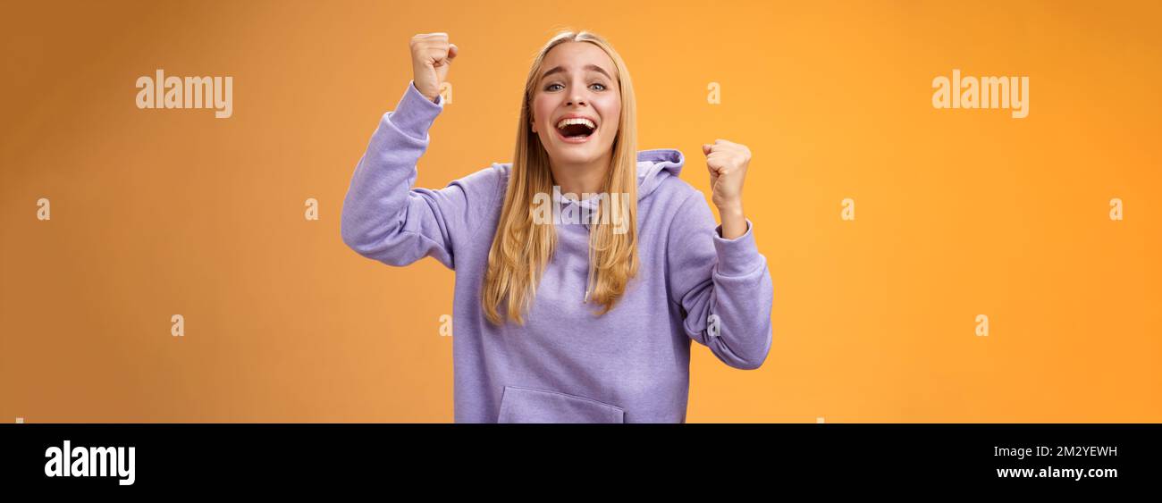 Happy cheerful young supportive woman cheering sister win smiling ...