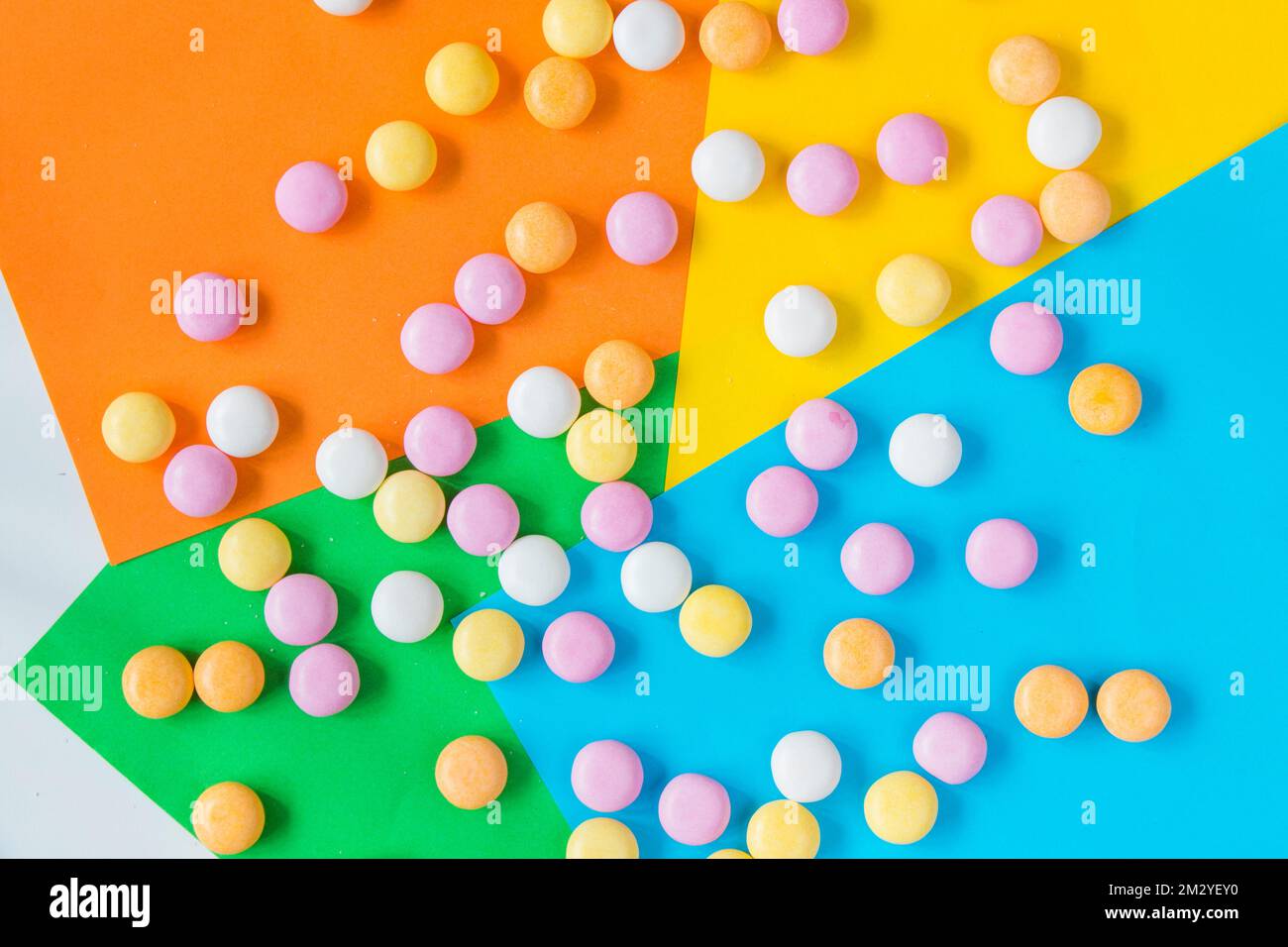 Candy on the colorful background, high angle view, circle candies Stock ...