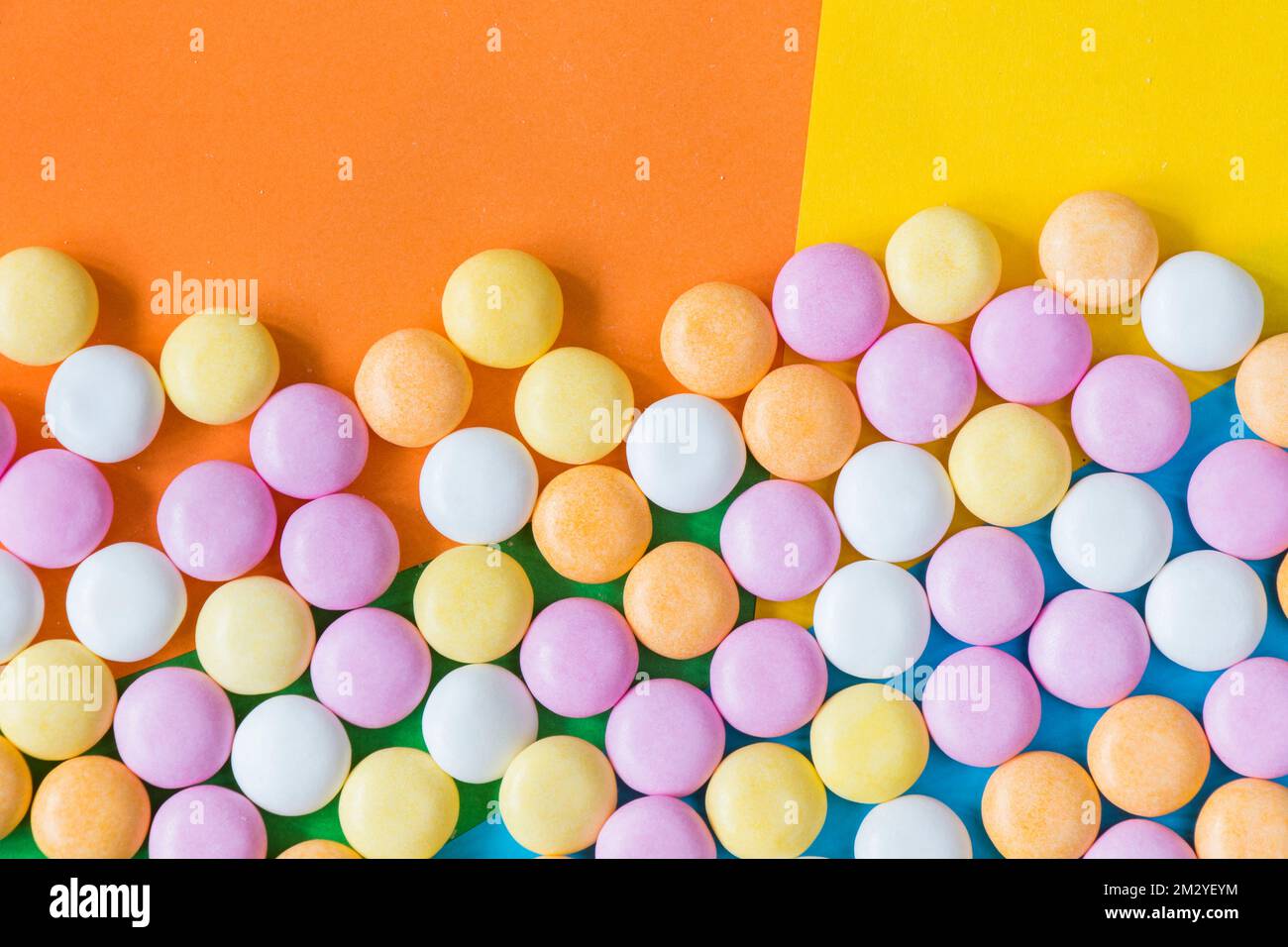 Candy on the colorful background, high angle view, circle candies Stock ...