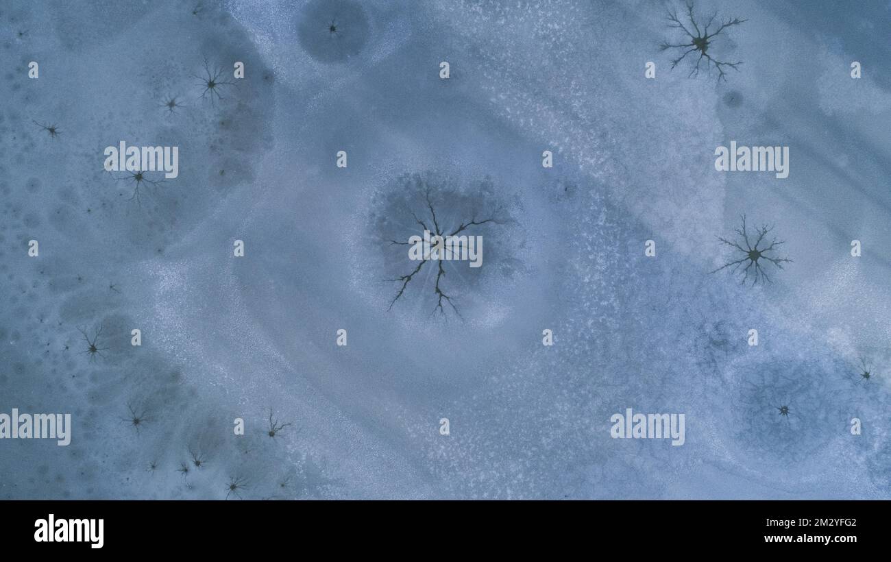 Drone image of so-called steam holes in the ice surface of a frozen ...