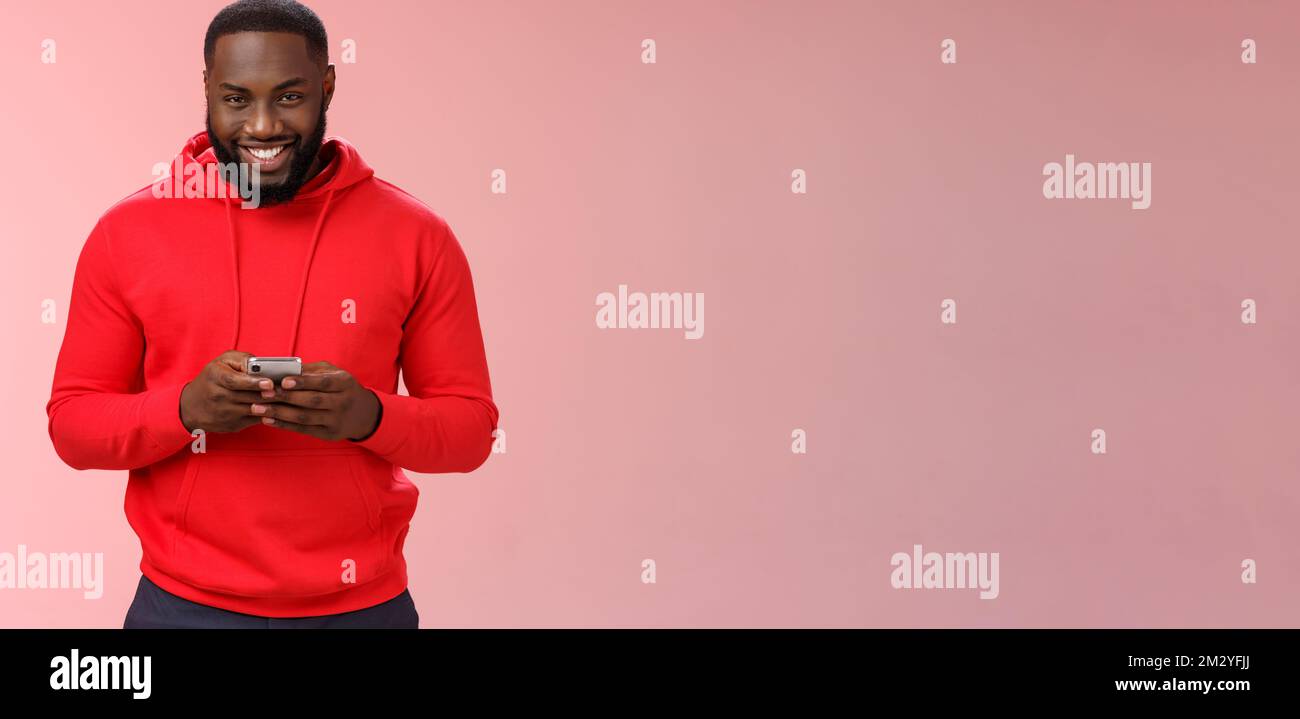 Attractive happy smiling african american bearded guy in red hoodie ...