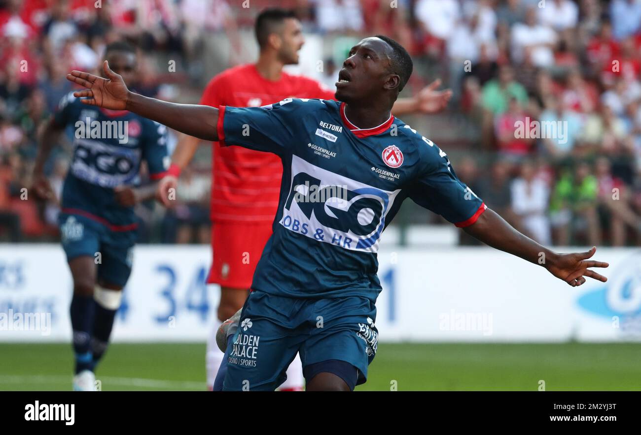 Kortrijk's Eric Ocansey celebrates after scoring during a soccer match ...