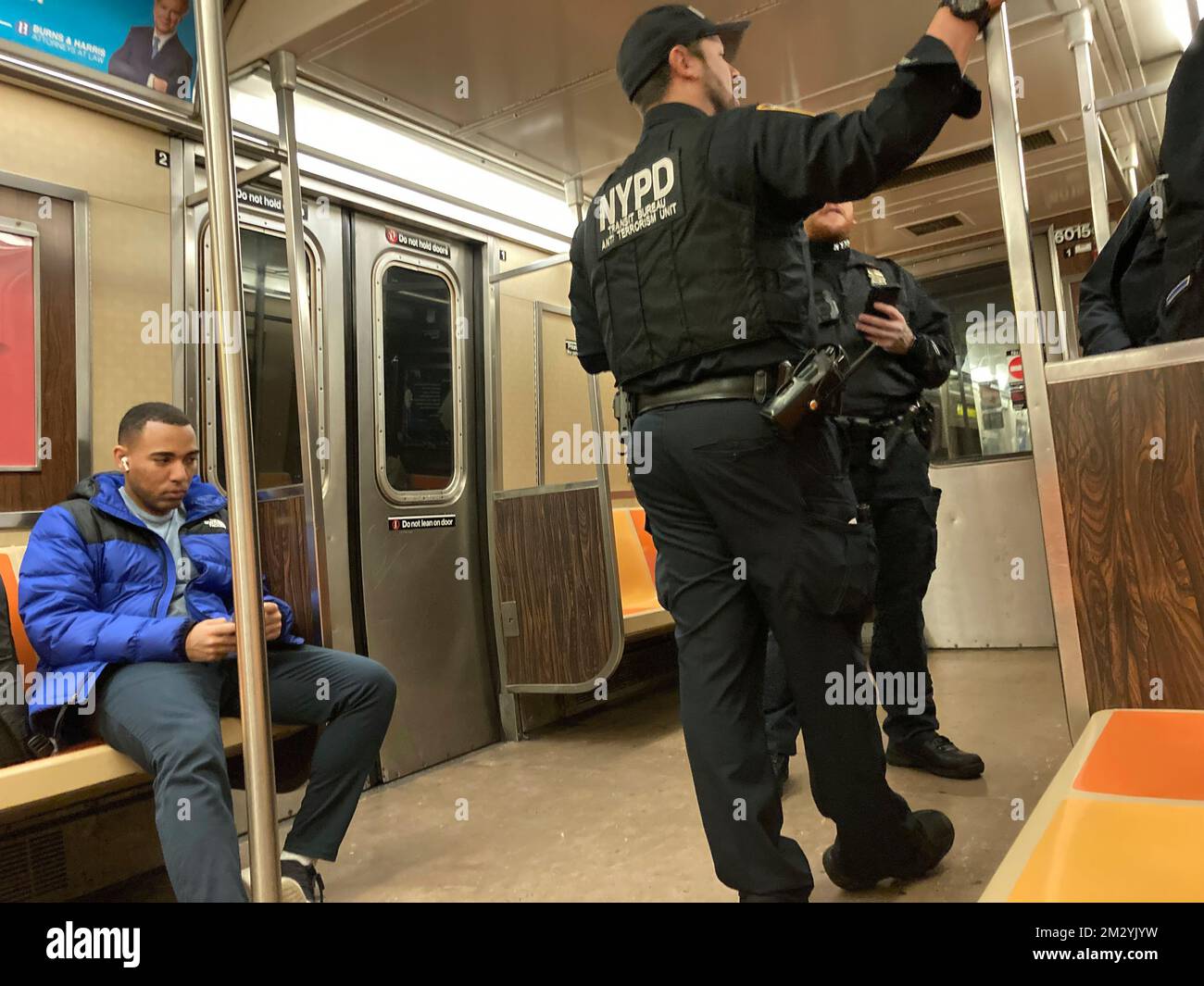 NYPD officers in the subway in New York on Wednesday, December 7, 2022 ...