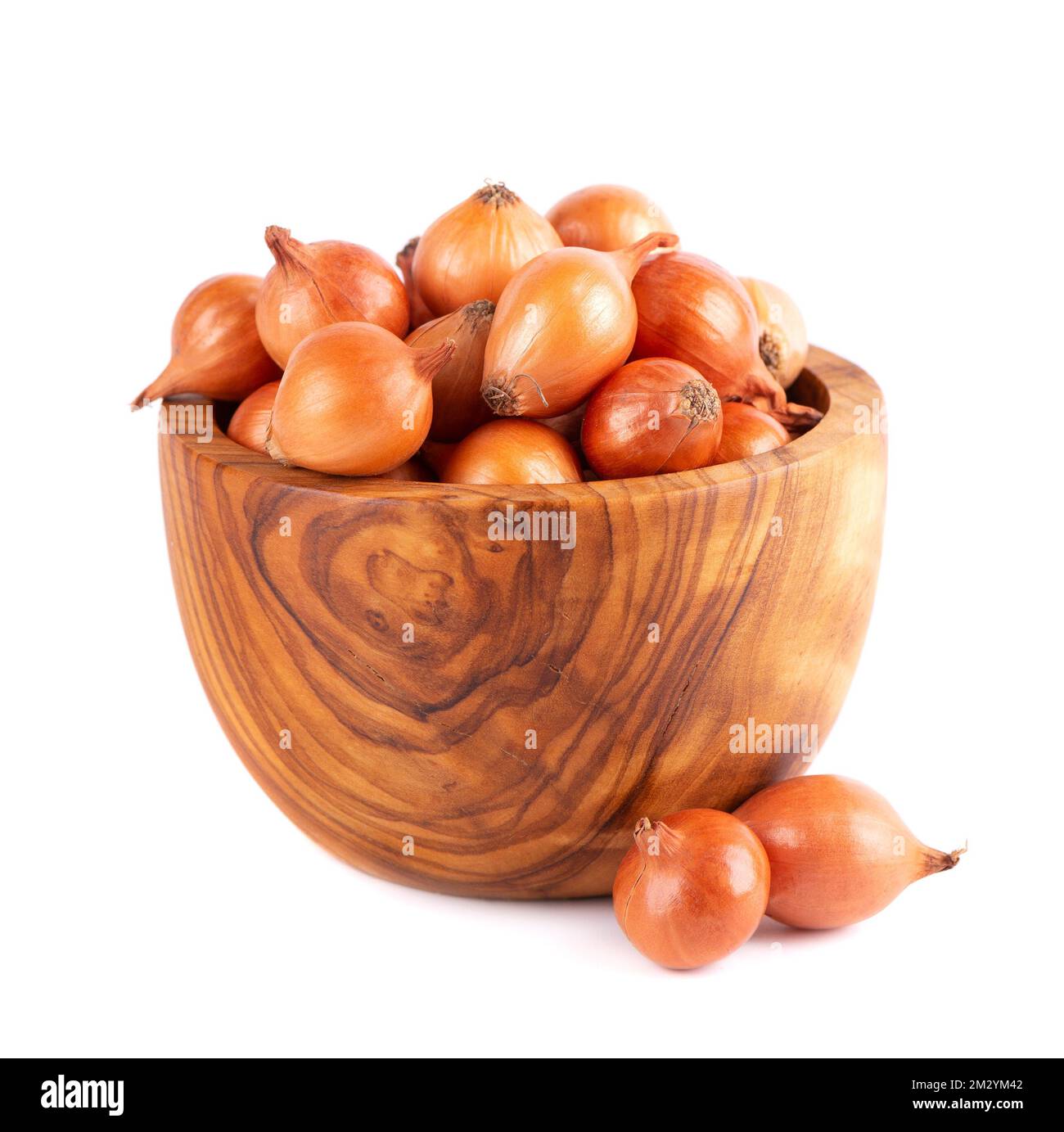 Brown mini onions in wooden bowl, isolated on a white background. Raw ...