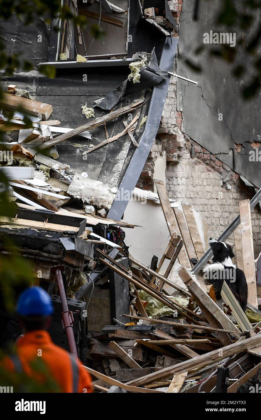 Rescue workers pictured at the site of an explosion in the center of ...