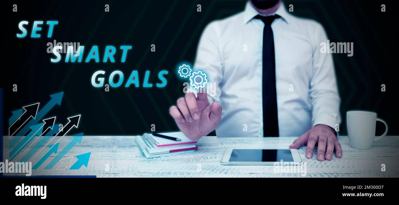 Hand writing sign Set Smart Goals. Business concept Establish ...