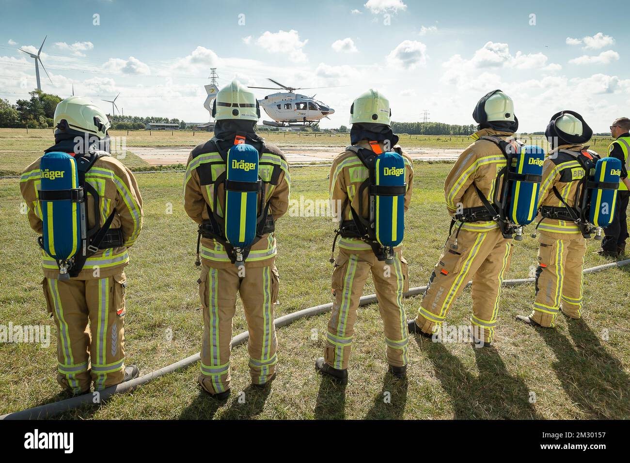 Fire fighters pictured as a helicopter carrying King Philippe - Filip ...