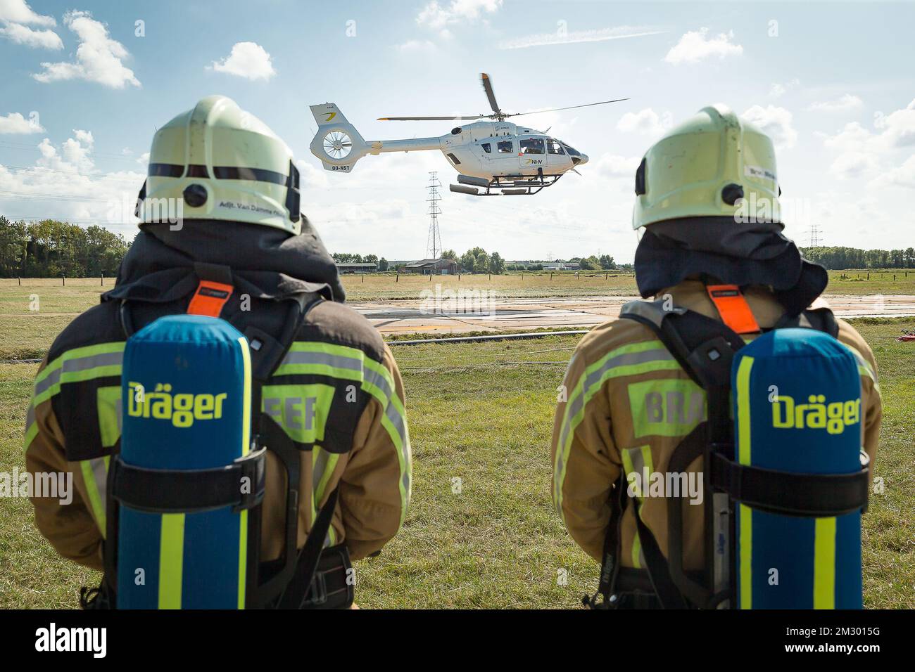 Fire fighters pictured as a helicopter carrying King Philippe - Filip ...