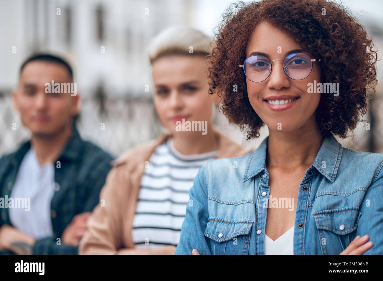 Group joyous friends smiling posing hi-res stock photography and images ...