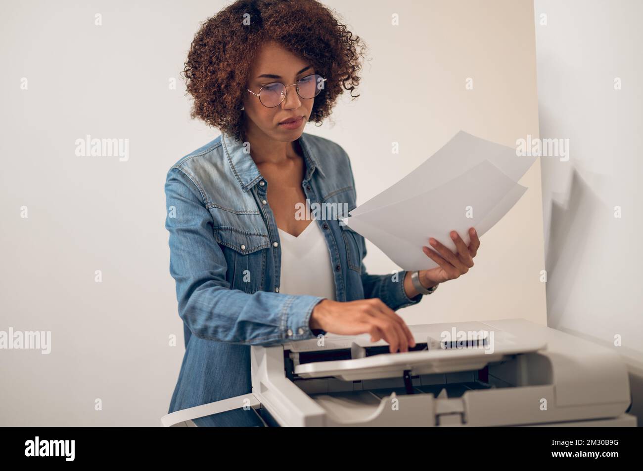 African American secretary preparing to make photocopies Stock Photo ...