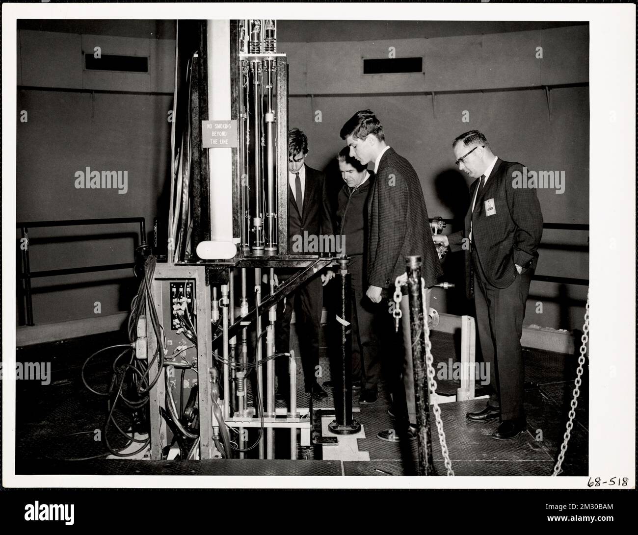 Four men around machine , Armories, Ordnance industry, Machinery ...