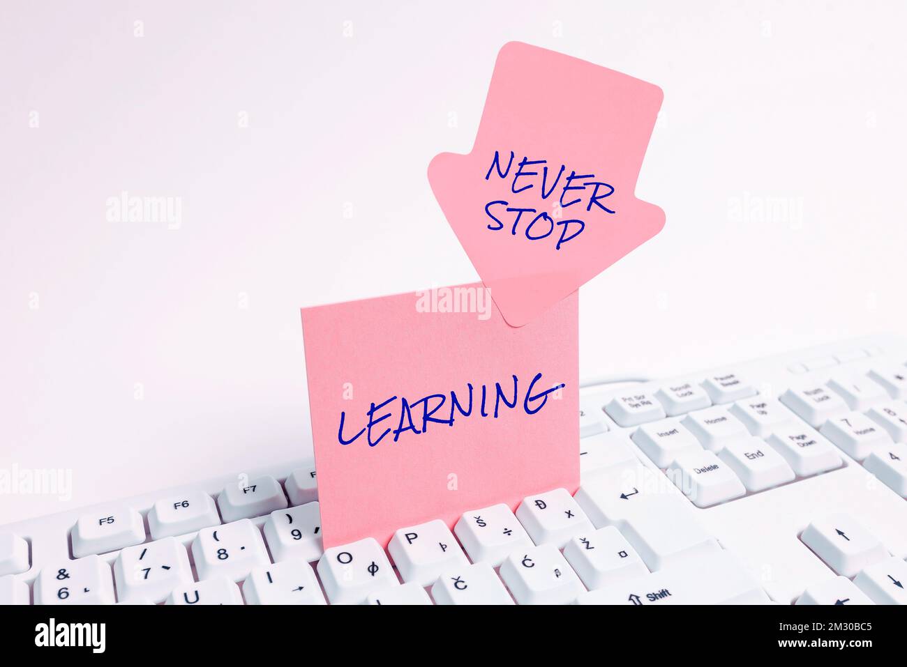 Hand writing sign Never Stop Learning. Word for Continue to Improve and ...