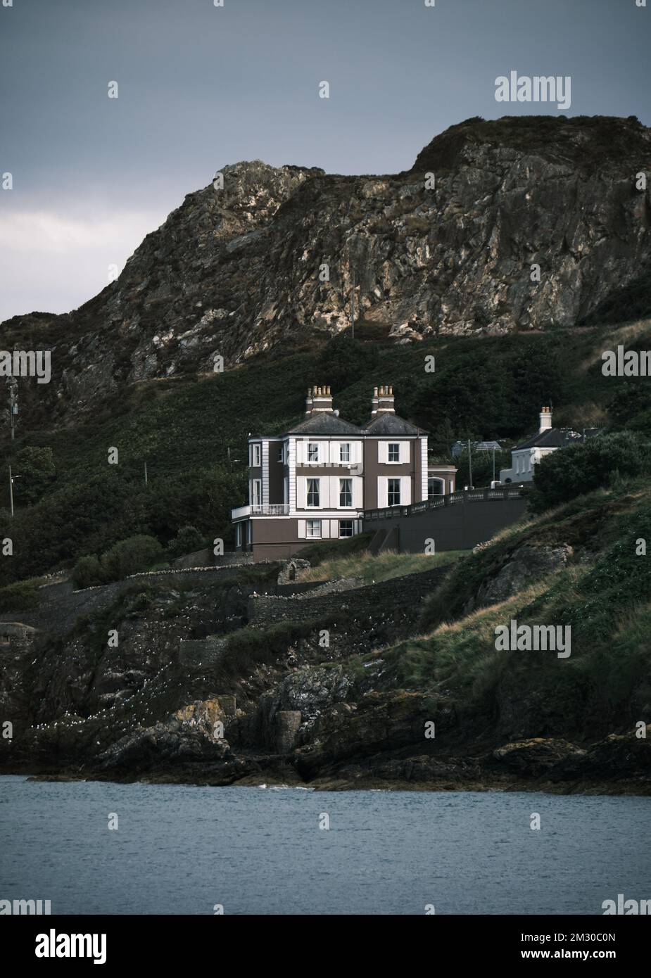 A vertical shot of a house on the Howth cliff in Ireland Stock Photo ...