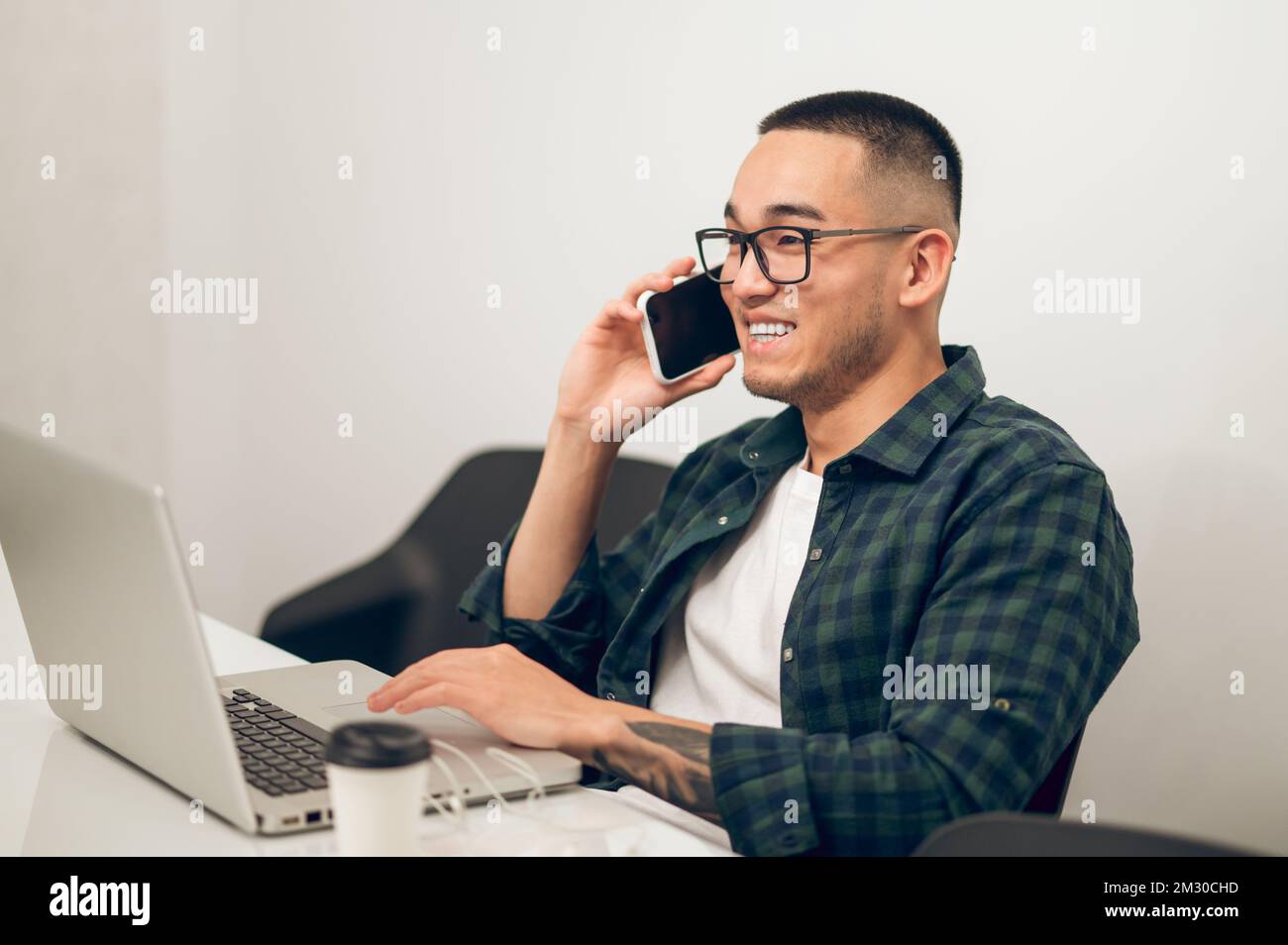 Cheerful employee talking cellphone dark hi-res stock photography and ...