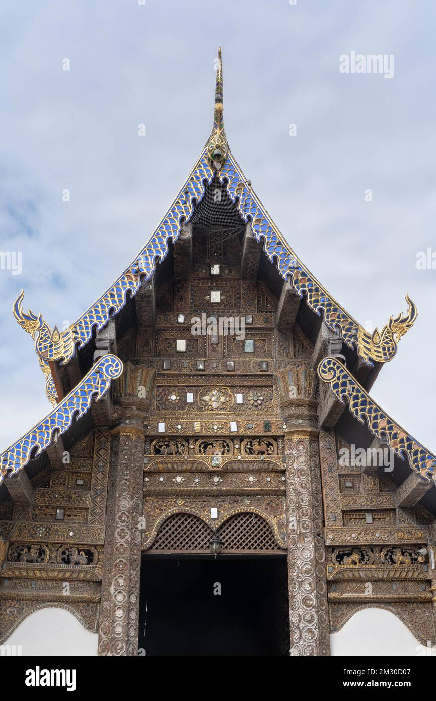 View of the beautiful wooden gable of ancient Lanna style vihara inside ...