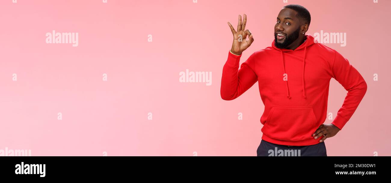 Guy hold everything under control assuring customer show okay sign ...