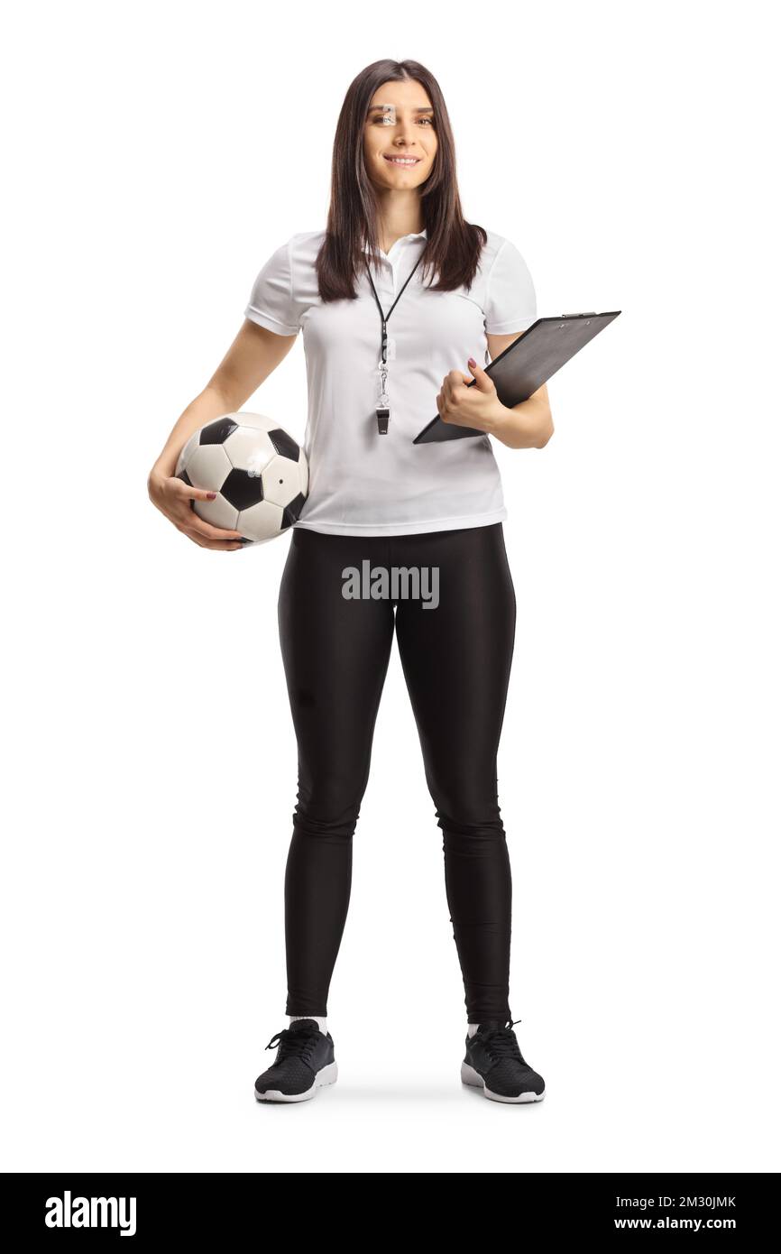 Full length portrait of a female football coach with a whistle holding ...