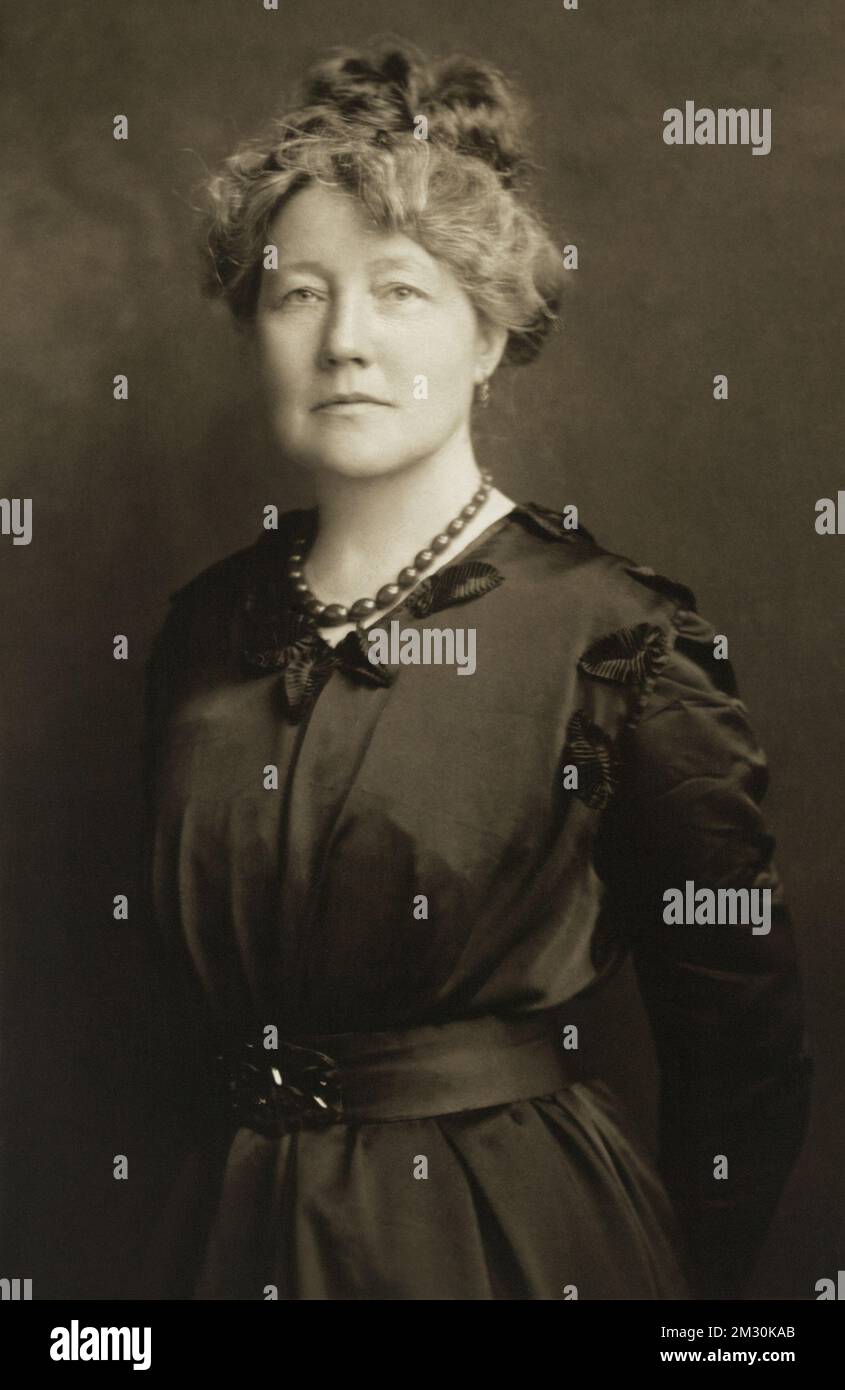 Ada S Flatman - Standing with arms pulled behind back, wearing dark ...