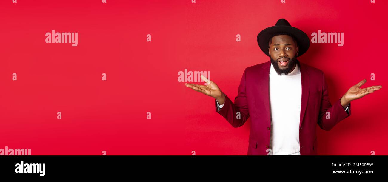 Image of confused Black man asking question, spread hands sideways and ...