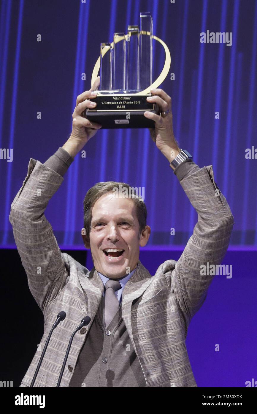 Salvatore Curaba, CEO of EASI holds up his trophy during the award ...
