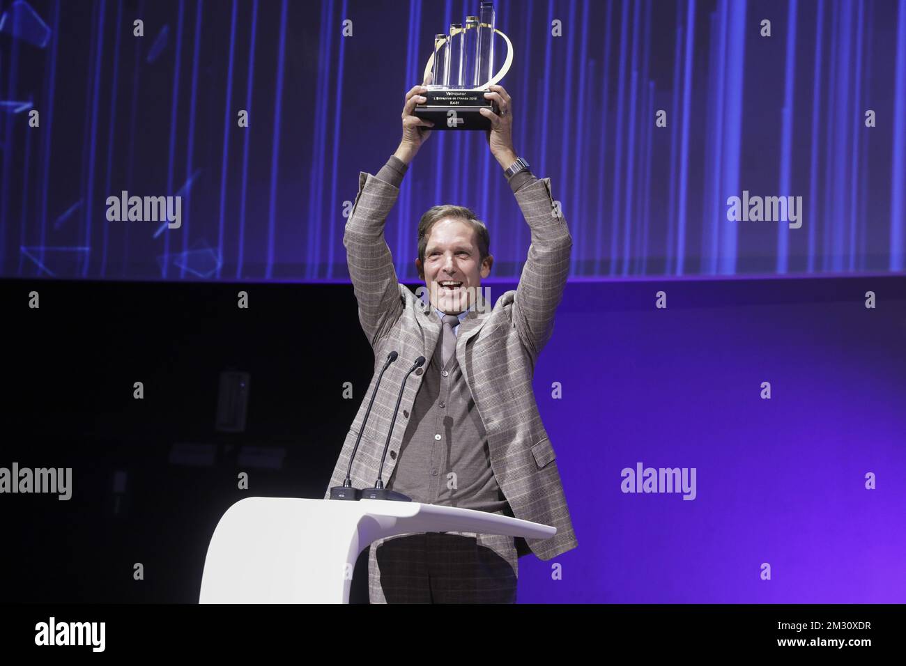 Salvatore Curaba, CEO of EASI holds up his trophy during the award ...
