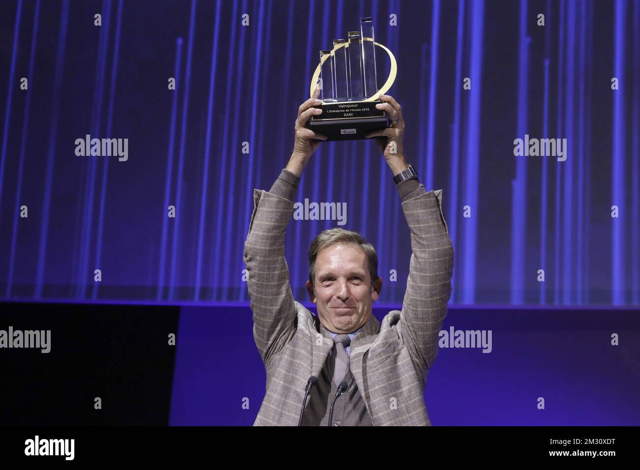 Salvatore Curaba, CEO of EASI holds up his trophy during the award ...