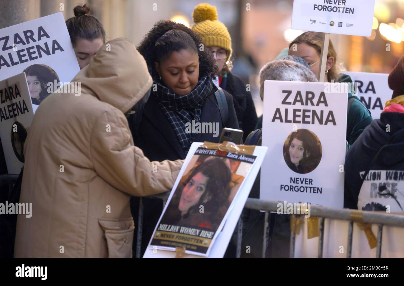 Protesters from Million Women Rise listen on a mobile phone outside the ...