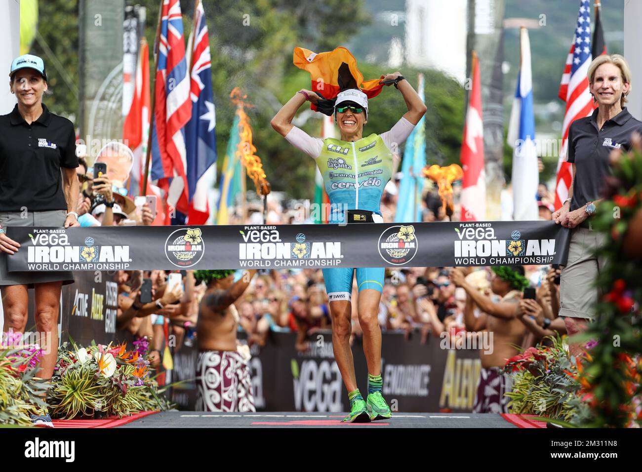 British Anna Haug crosses the finish line to win the Hawaii Ironman ...