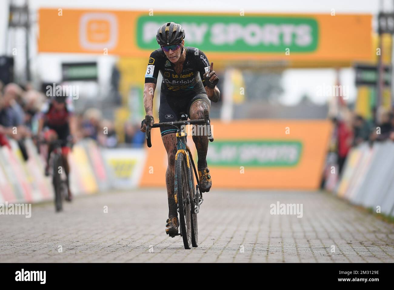 Belgian Ellen Van Loy crosses the finish line at the women's race at ...