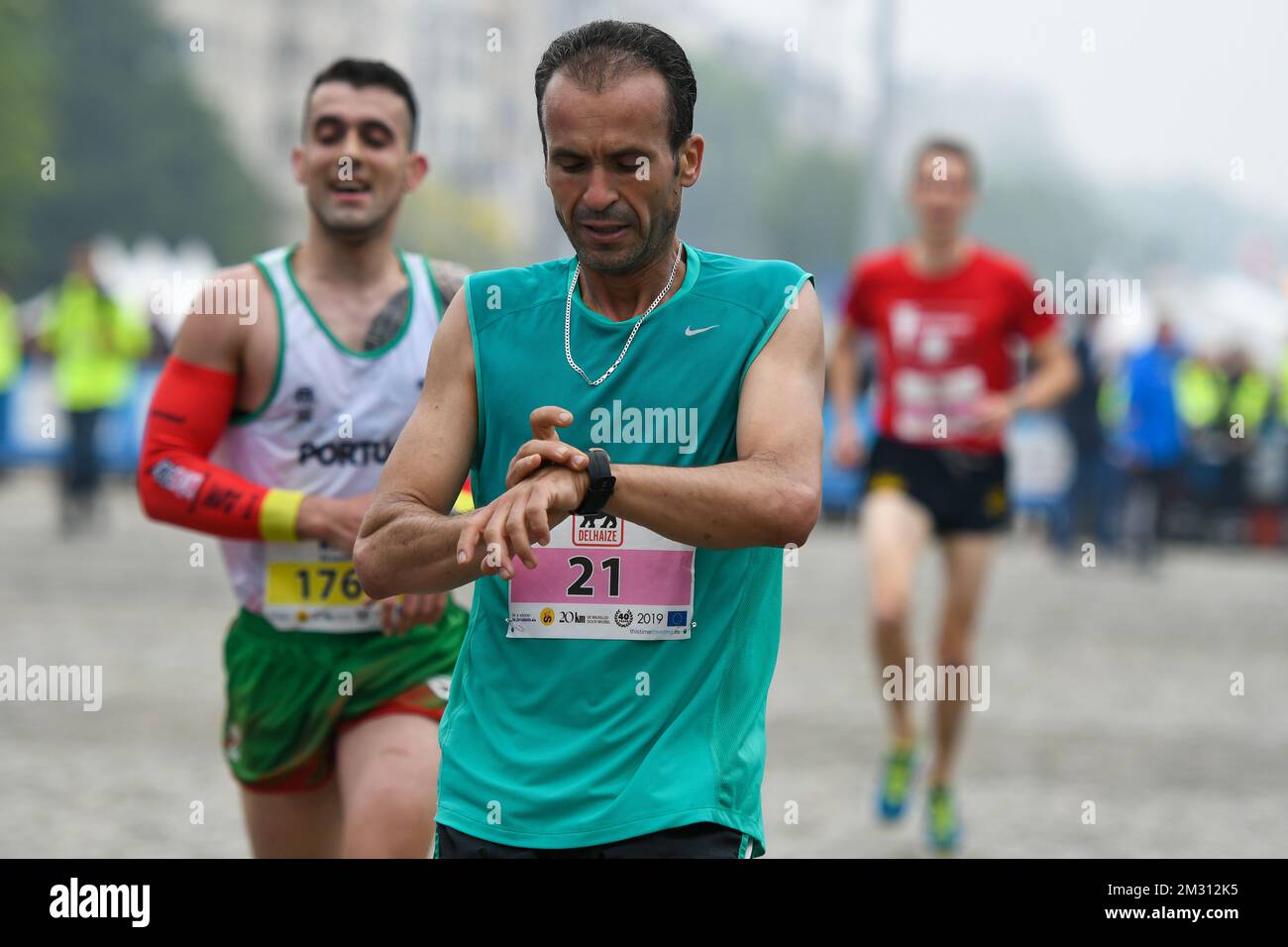 Runners at the finish line of the 40th edition of the Brussels 20km run ...
