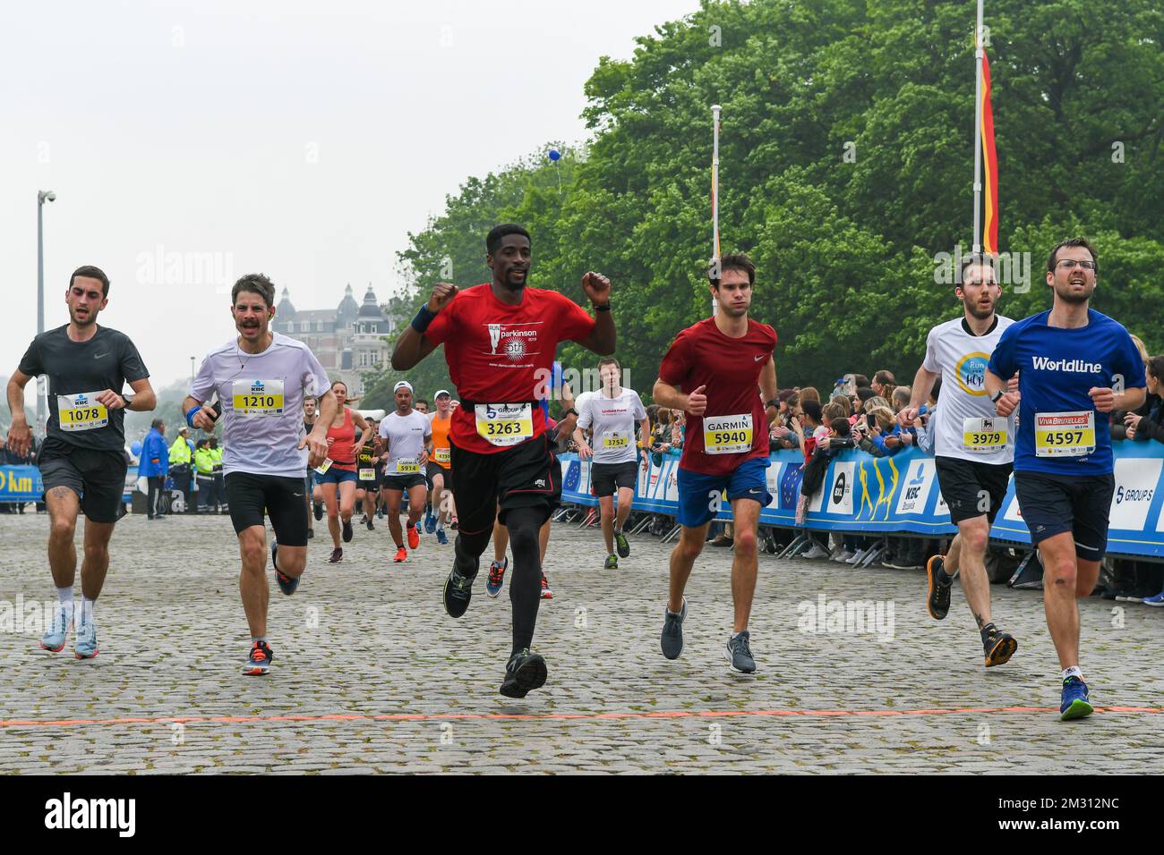 Runners at the finish line of the 40th edition of the Brussels 20km run ...
