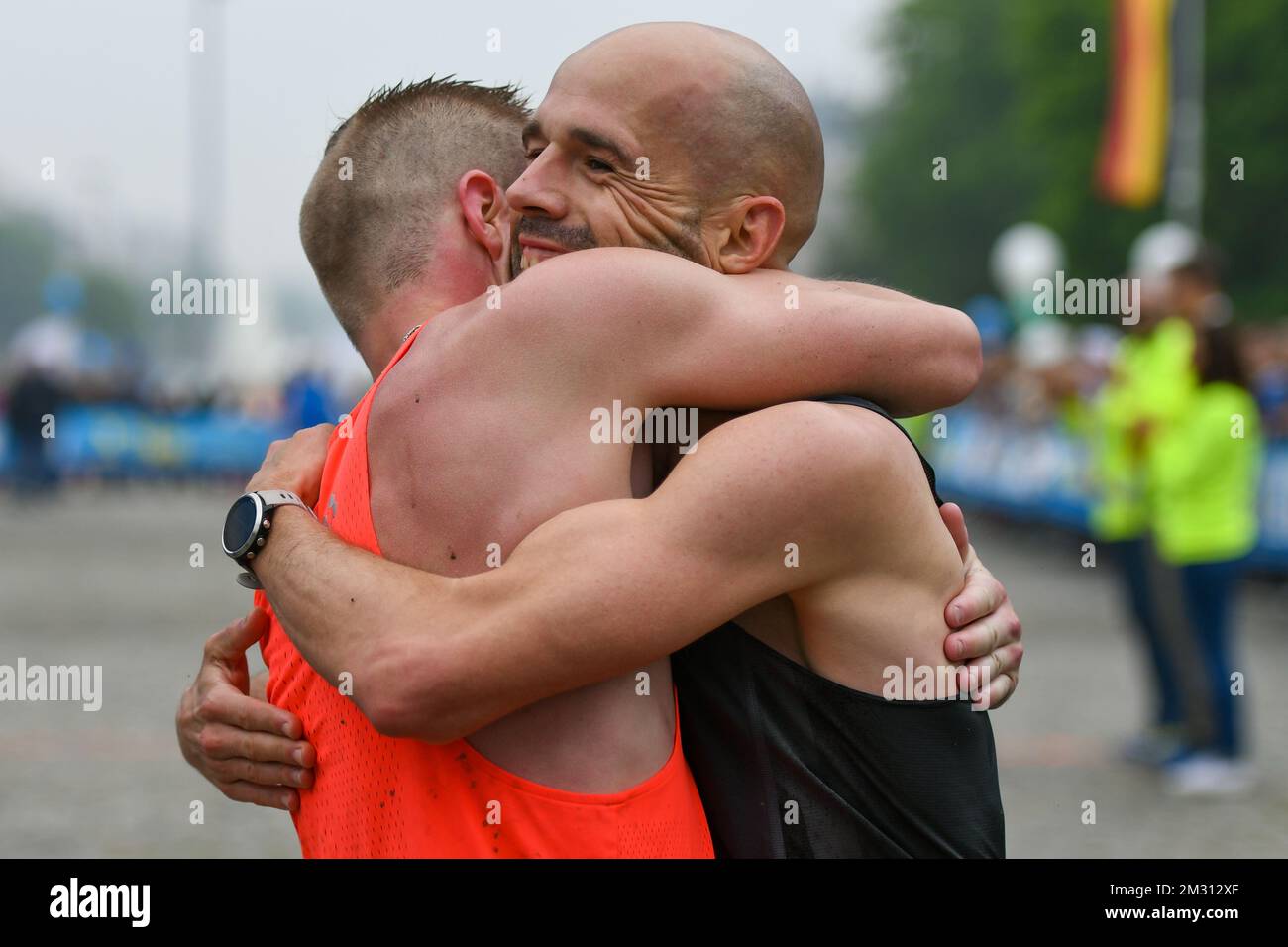 Runners celebrate after crosses the finish line of the 40th edition of ...