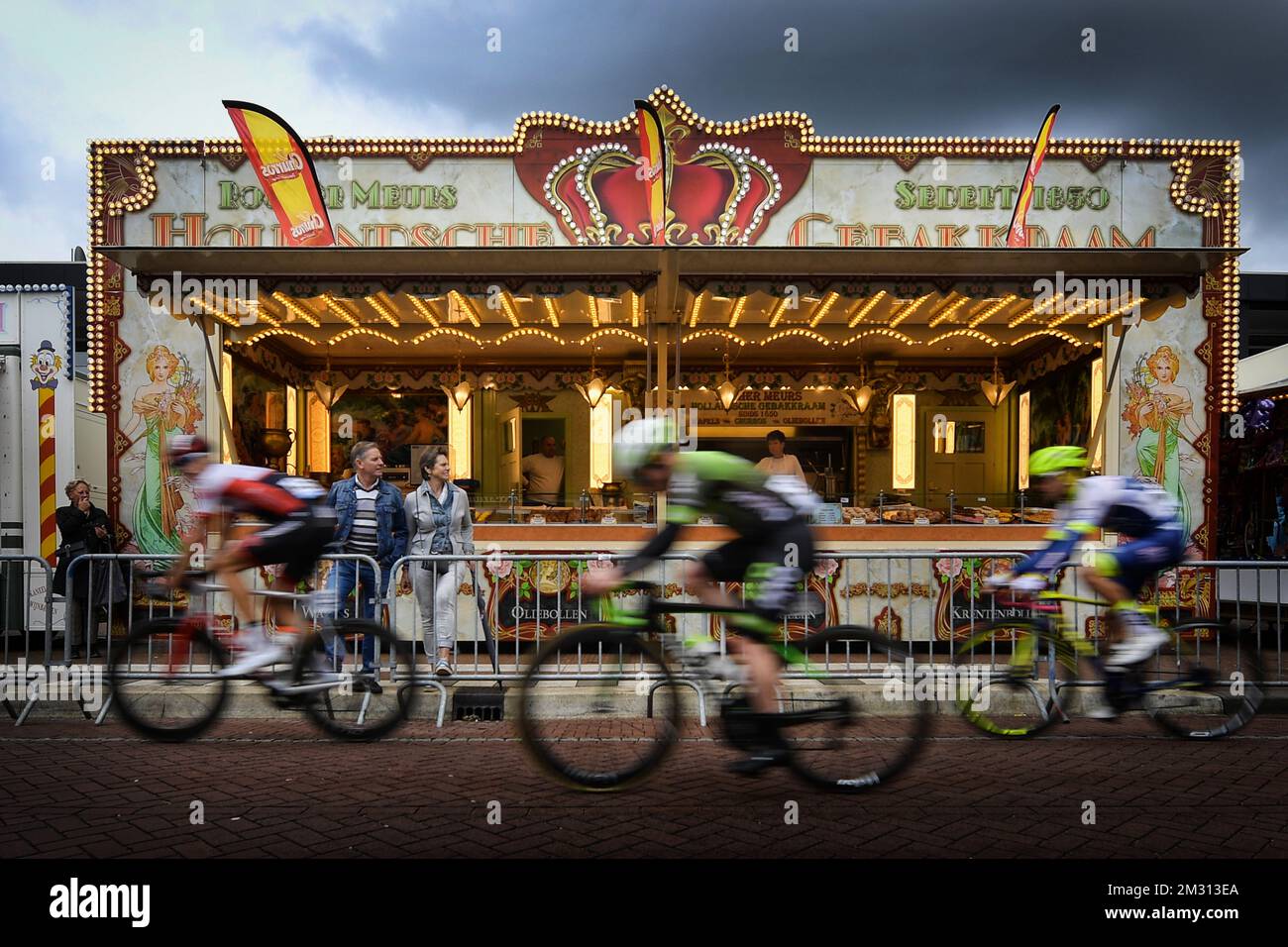 Illustration picture shows riders passing by a fair during the 85th ...