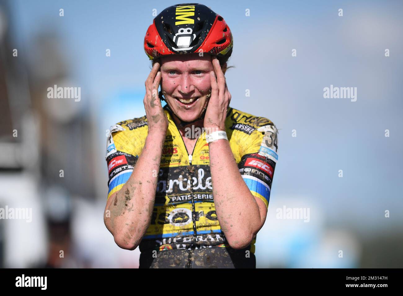 Belgian Kim Van De Steene celebrates as she crosses the finish line to ...