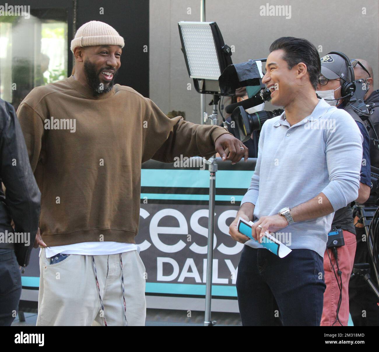 Stephen Boss, aka tWitch and Mario Lopez taping "Access Daily" outside ...