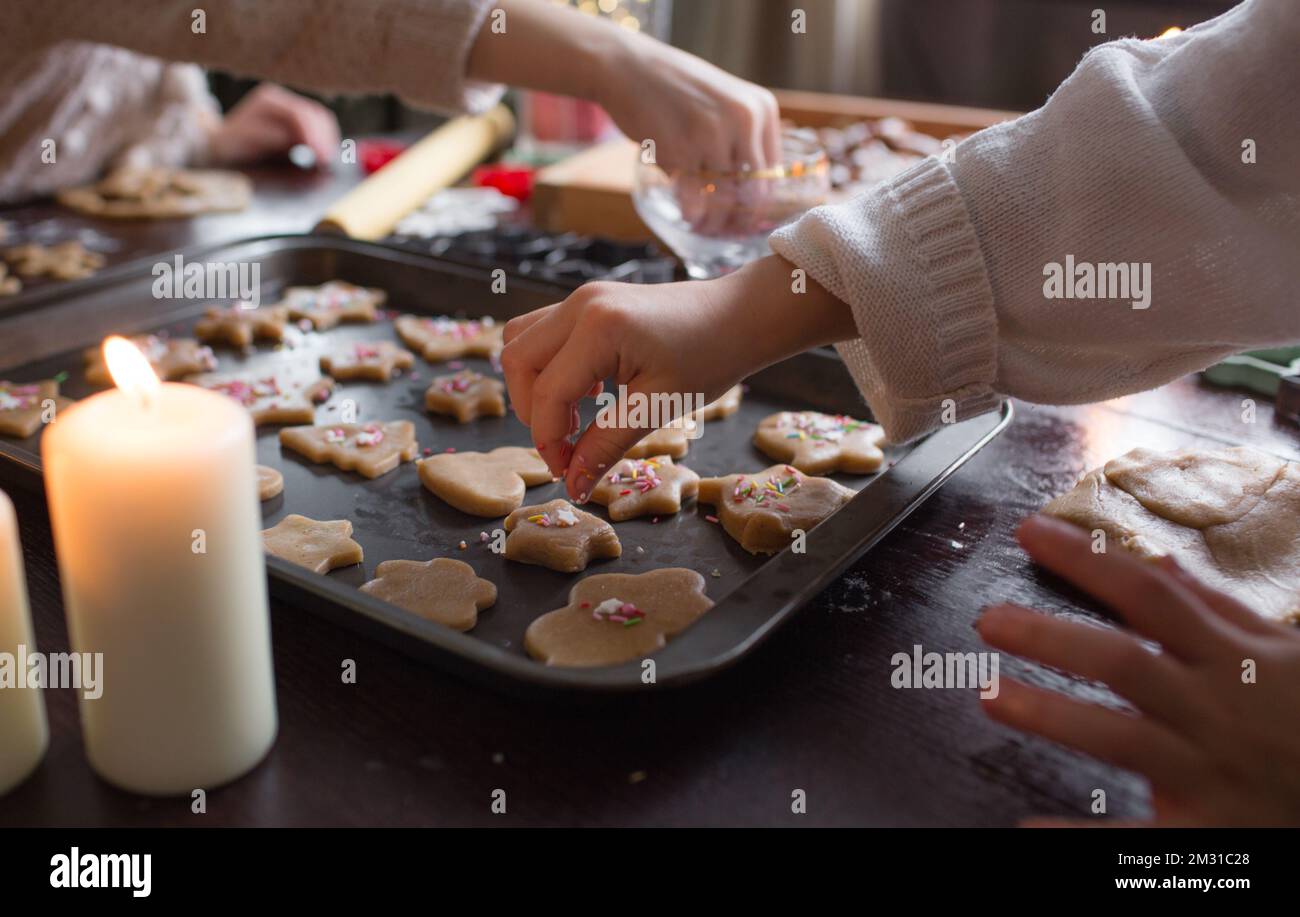 Little girl's hands make Christmas cookies. The little cook Stock Photo ...
