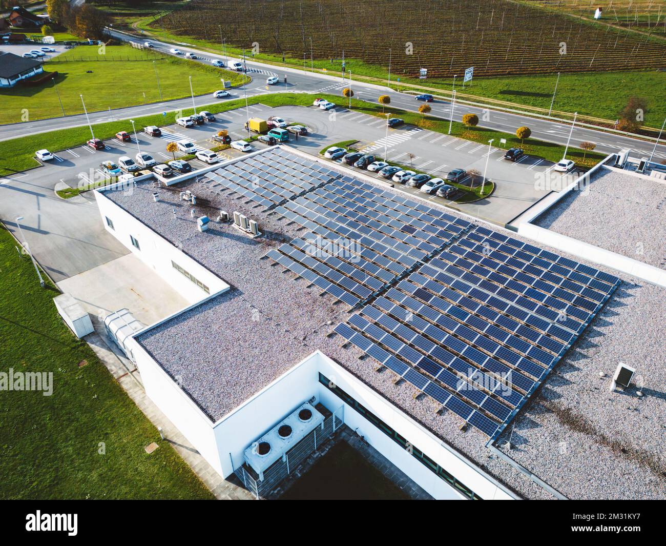 Modern shopping centre building with rooftop covered in solar panels ...