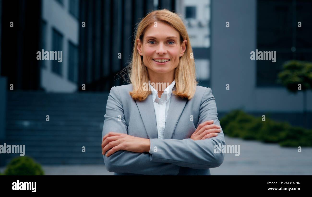 Close-up confident successful young businesswoman in formal suit posing ...