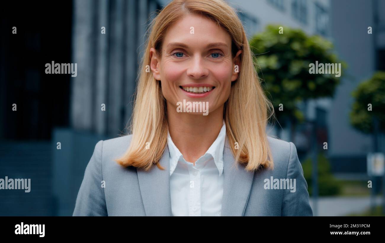 Female portrait young satisfied caucasian woman client looking at ...
